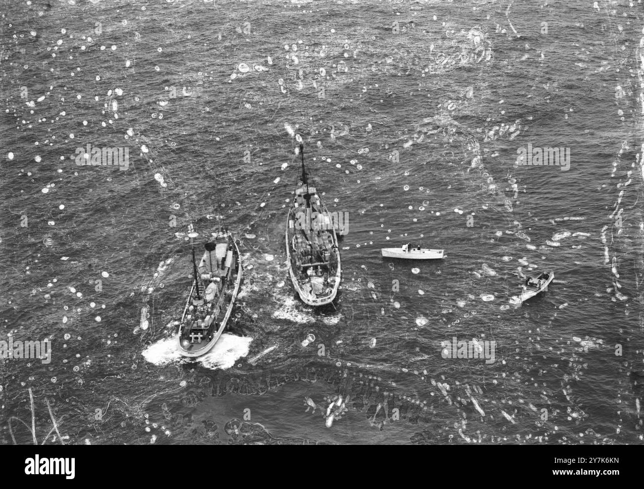 With her diving bell swinging from a boom at her stern, the Navy's ...