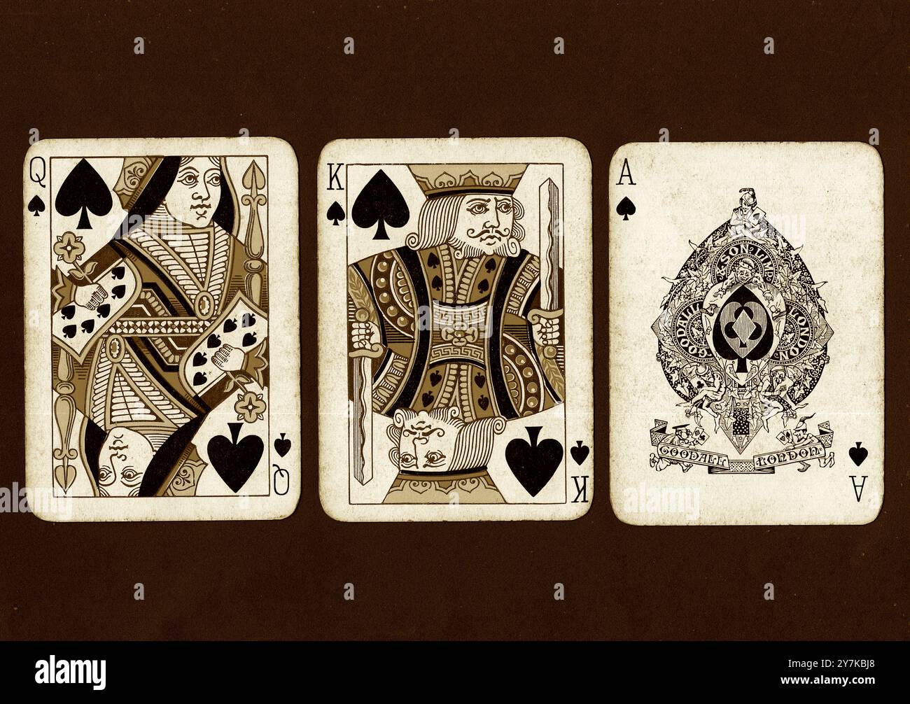 A run of queen, king and ace of spades vintage playing cards in sepia ...