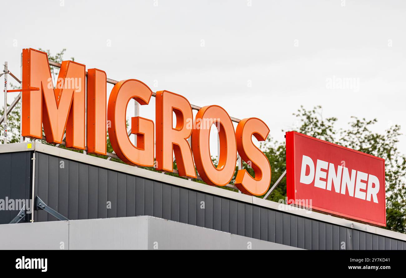 Pfungen, Switzerland, 25th Aug 2024: Logo of the discounter Denner and the retailer Migros ...