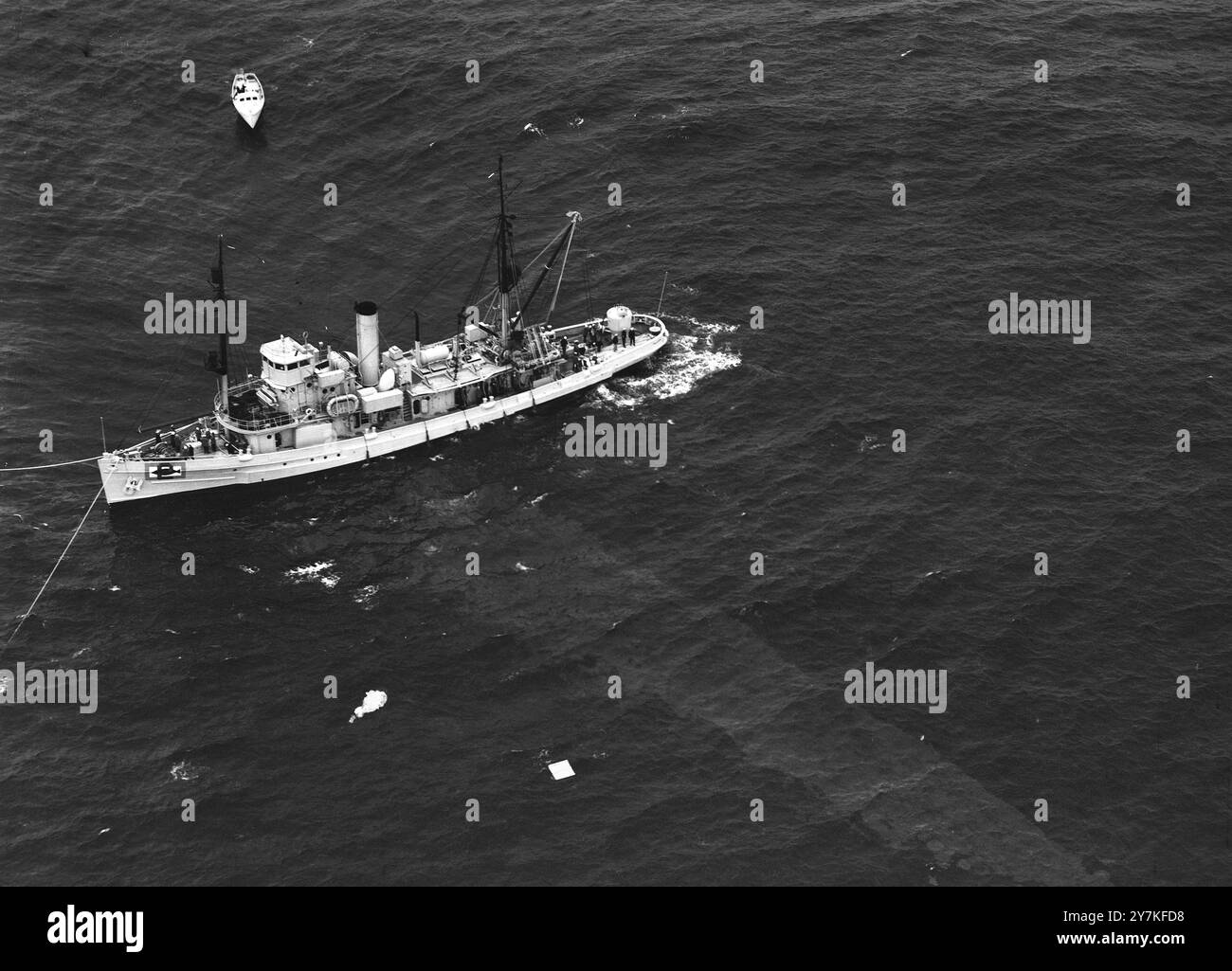 This big submarine rescue boat, Falcon, is shown in the churning sea ...