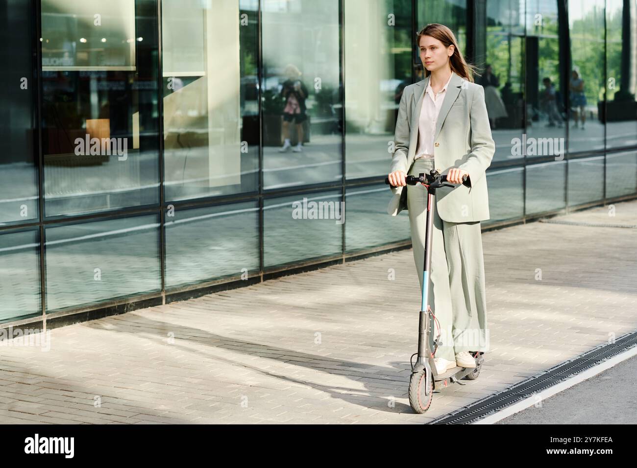 Gen Z Businesswoman Riding Electric Scooter Stock Photo - Alamy