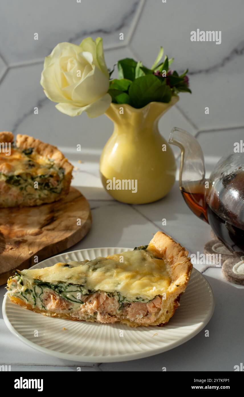 Breakfast in the sunshine. French quiche pie and flavored tea. Proper ...