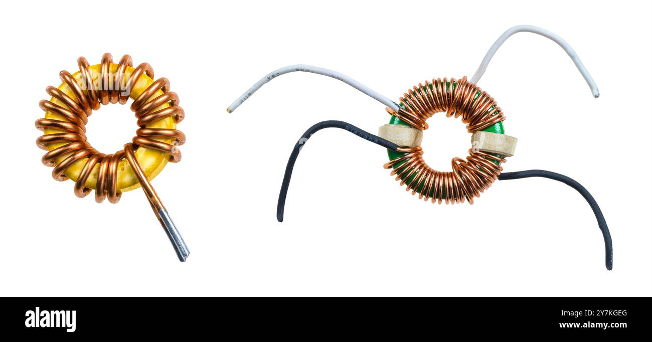 Closeup of toroidal inductor and transformer isolated on white ...