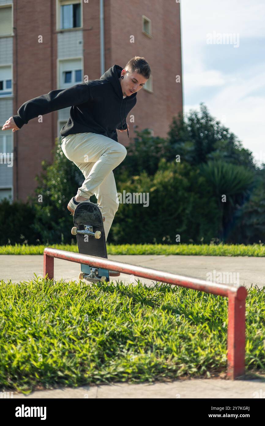 vertical skater leaping over a vibrant red rail at the skate park ...