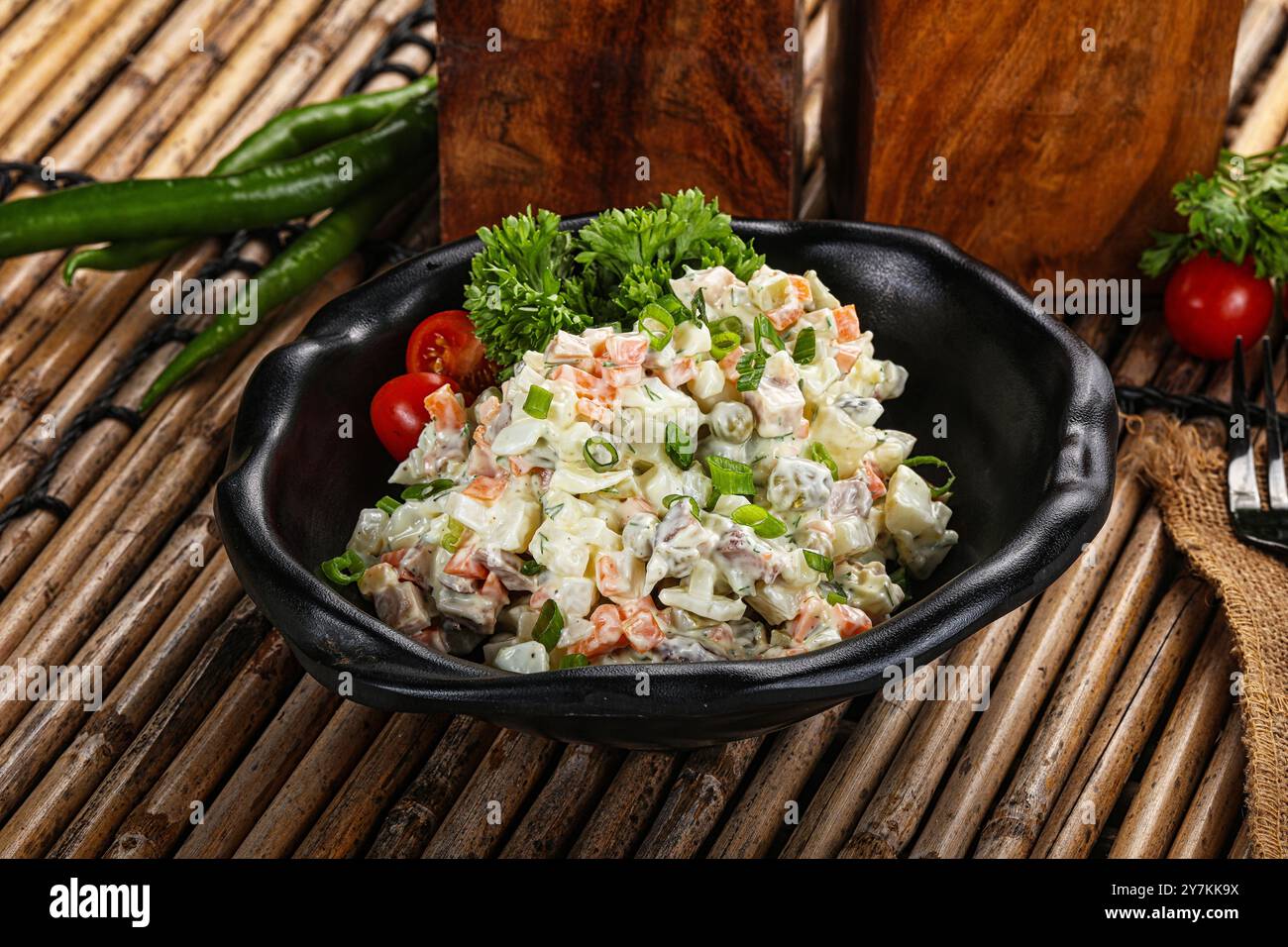 Traditional Russian salad with mayonnaise, meat, potato and peas Stock ...