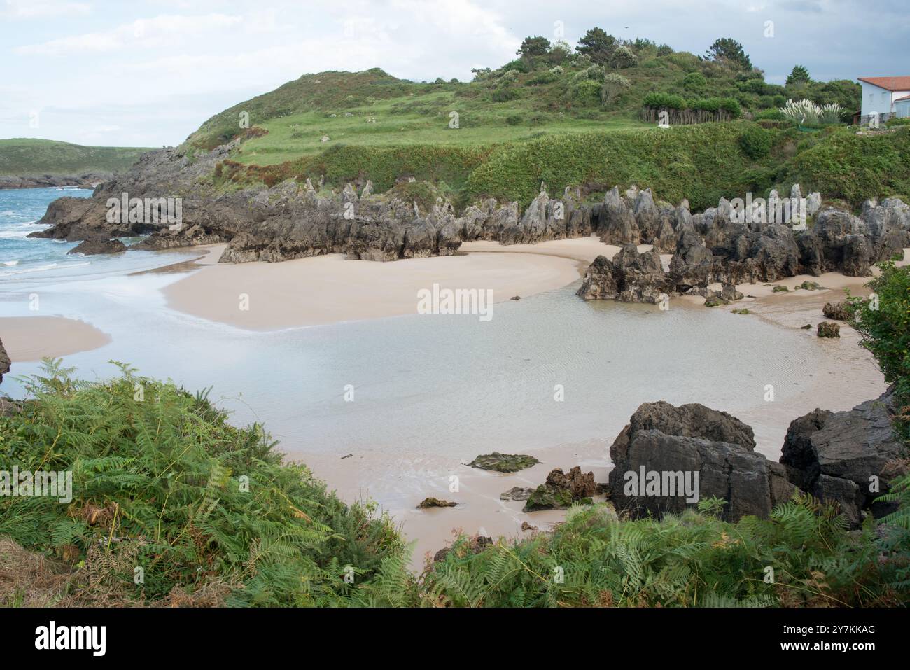 Aerial view of a rocky sandy beach in Llanes, Asturias. Barro beach. No ...