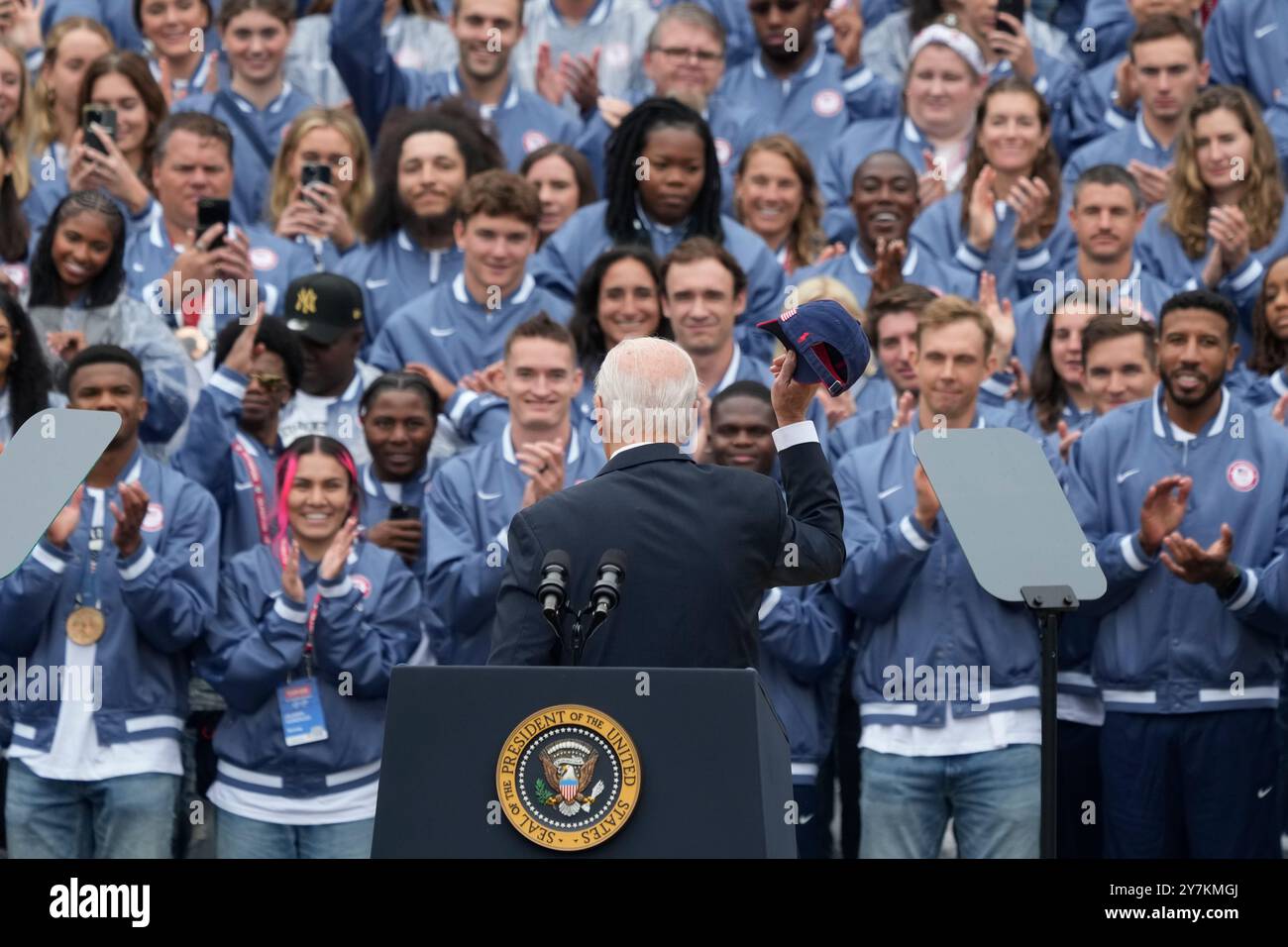 United States President Joe Biden tips his cap at an event celebrating ...