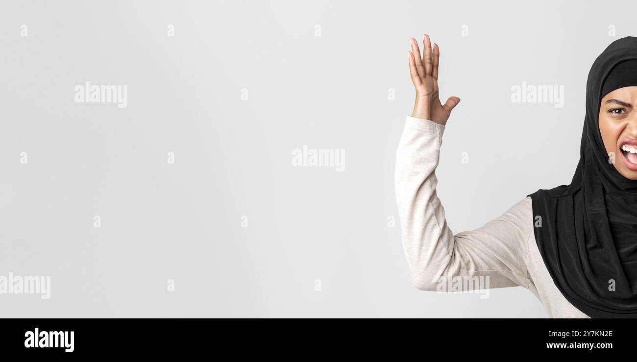 Angry black muslim girl shouting and raising hands in fury Stock Photo ...