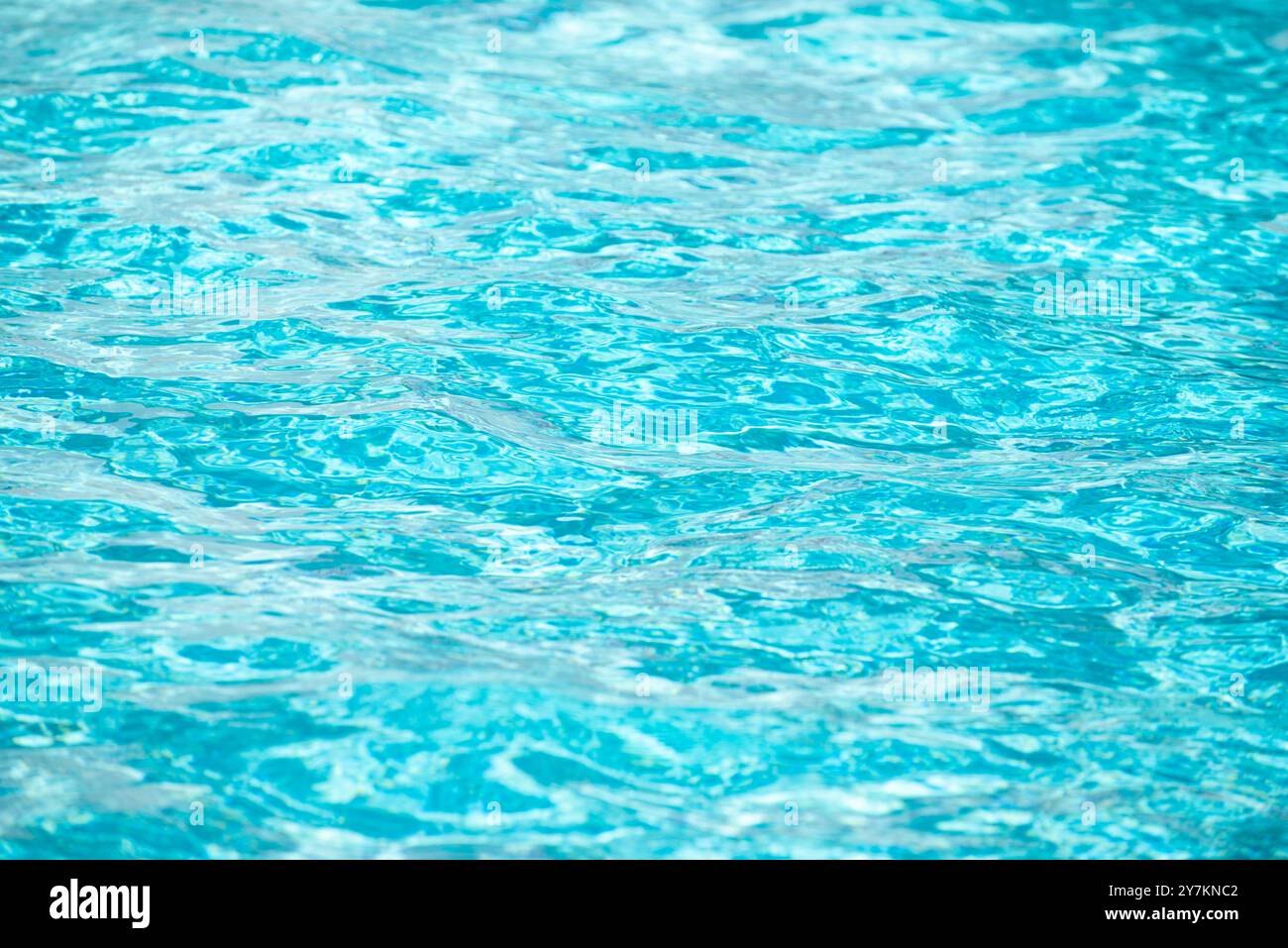 Background of blue water in swimming pool with sun reflection, ripple ...