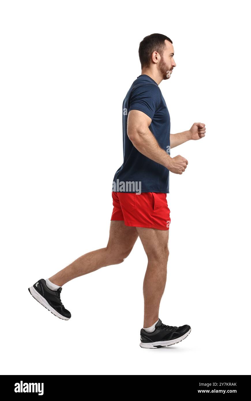Handsome young man running on white background Stock Photo - Alamy