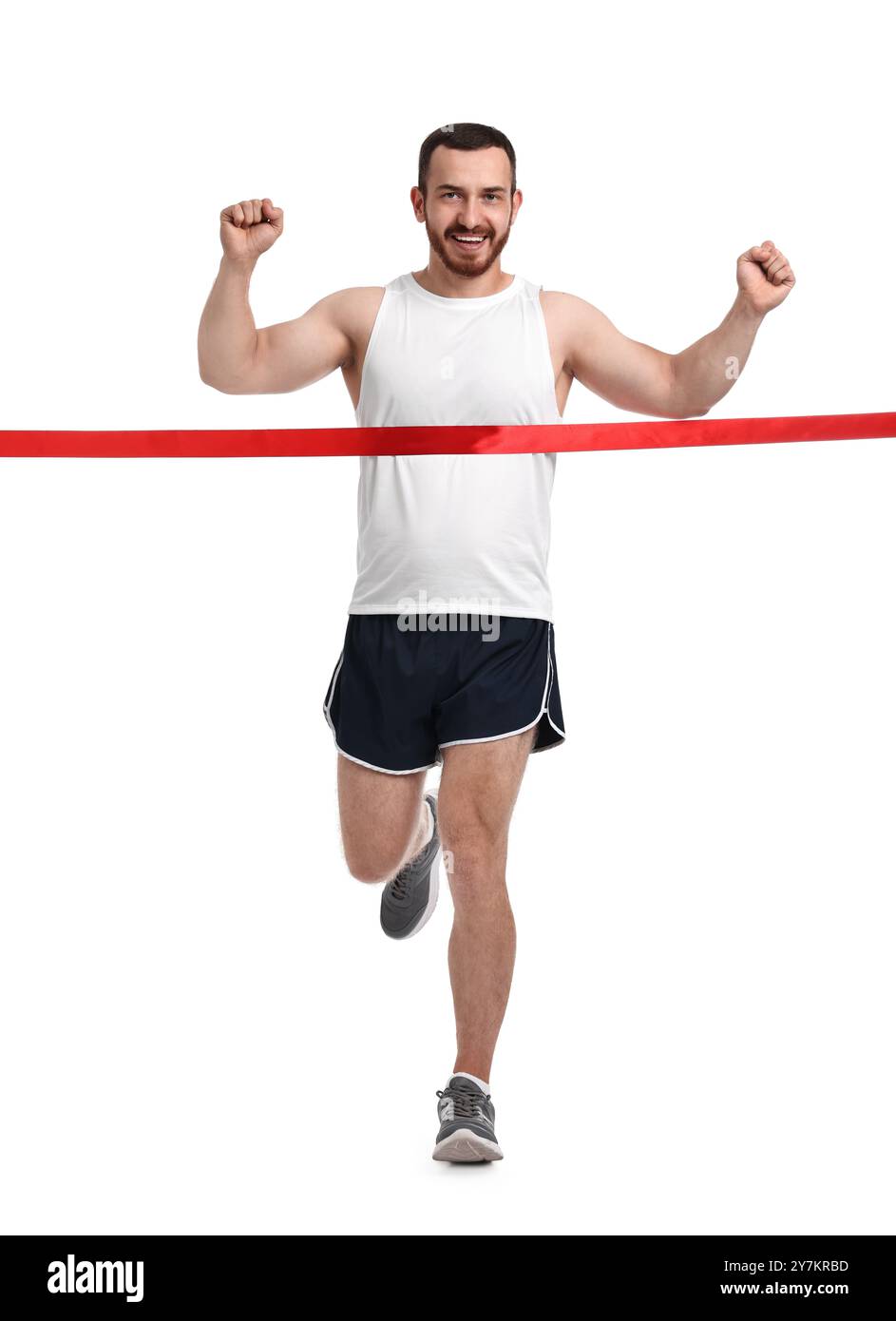 Handsome young man crossing red finish line on white background Stock ...