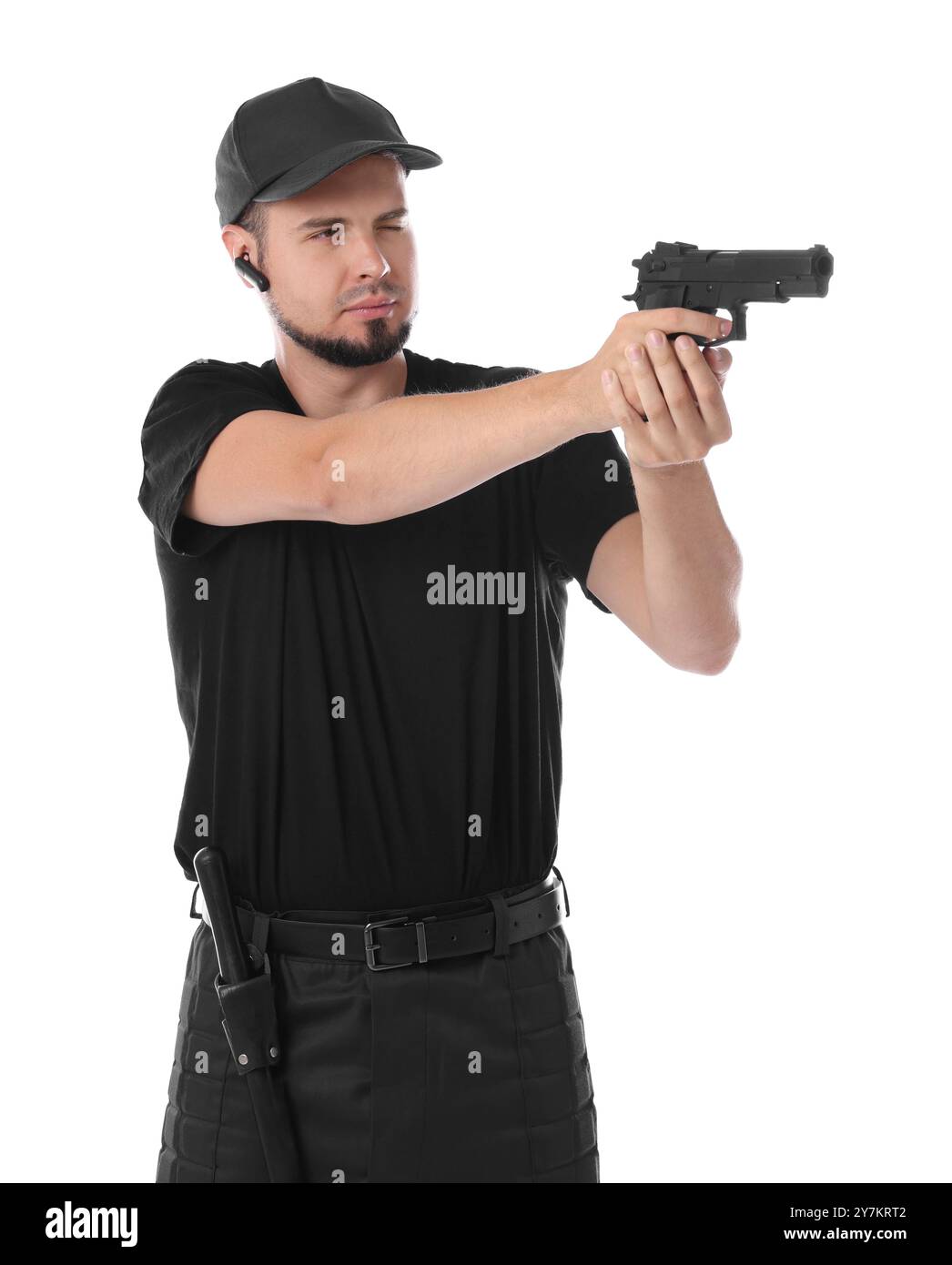 Young bodyguard using gun on white background Stock Photo - Alamy
