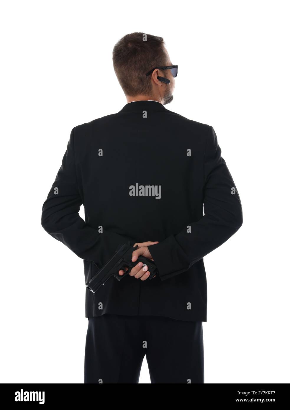 Bodyguard in suit with gun isolated on white, back view Stock Photo - Alamy
