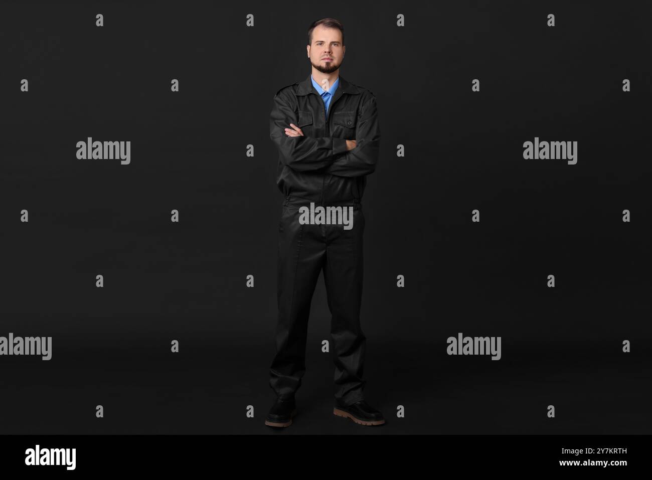 Security guard in uniform on black background Stock Photo - Alamy