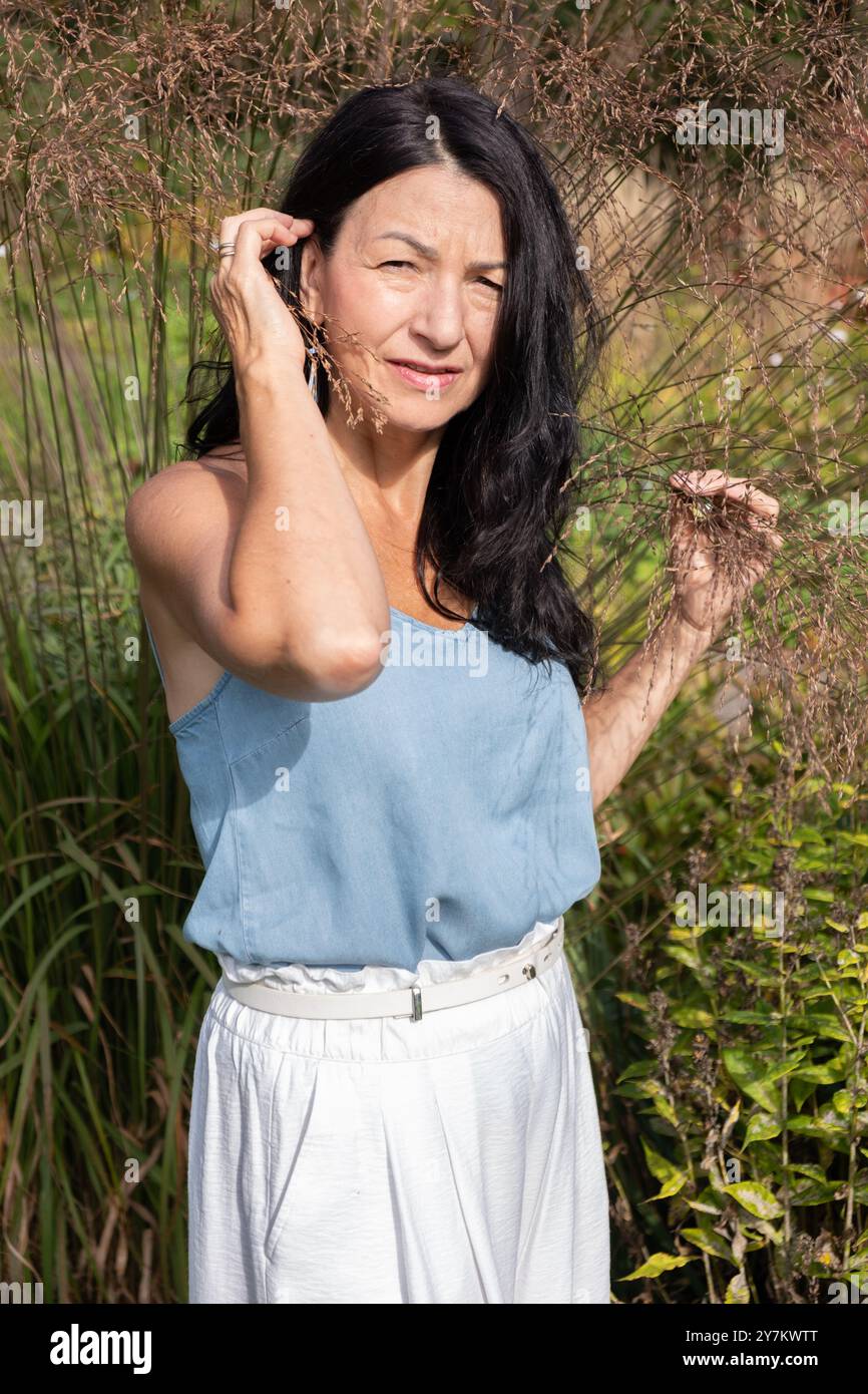 Midlife woman embracing the stages of menopause, womanhood, wisdom, and ...