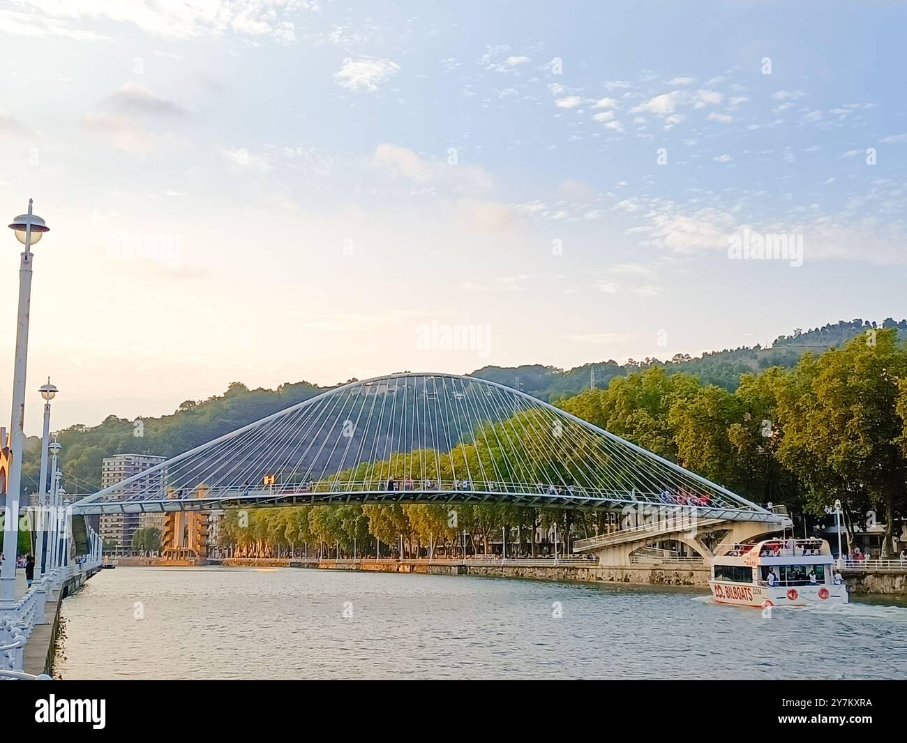Zubizuri footbridge across Nervion river, Bilbao, Spain. Tied arch ...