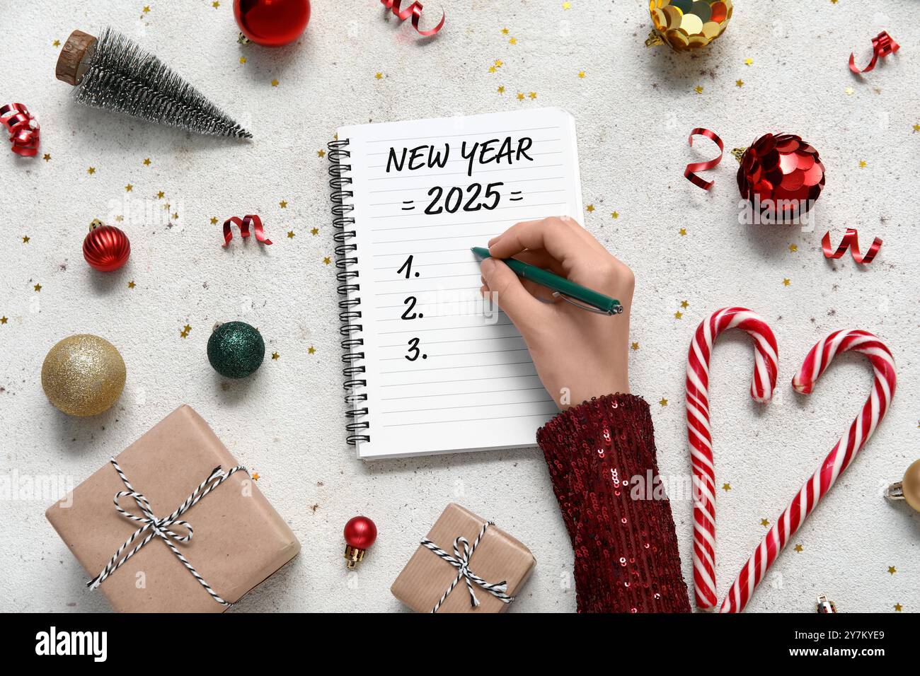 Woman making to do list for 2025 year on light background Stock Photo ...