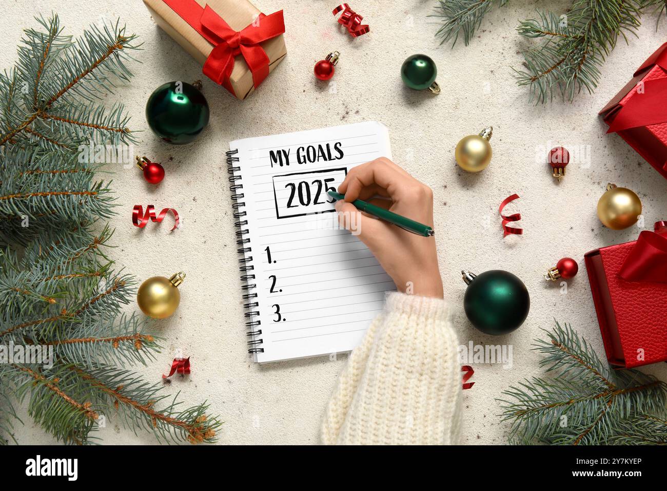 Woman making to do list for 2025 year on light background Stock Photo ...