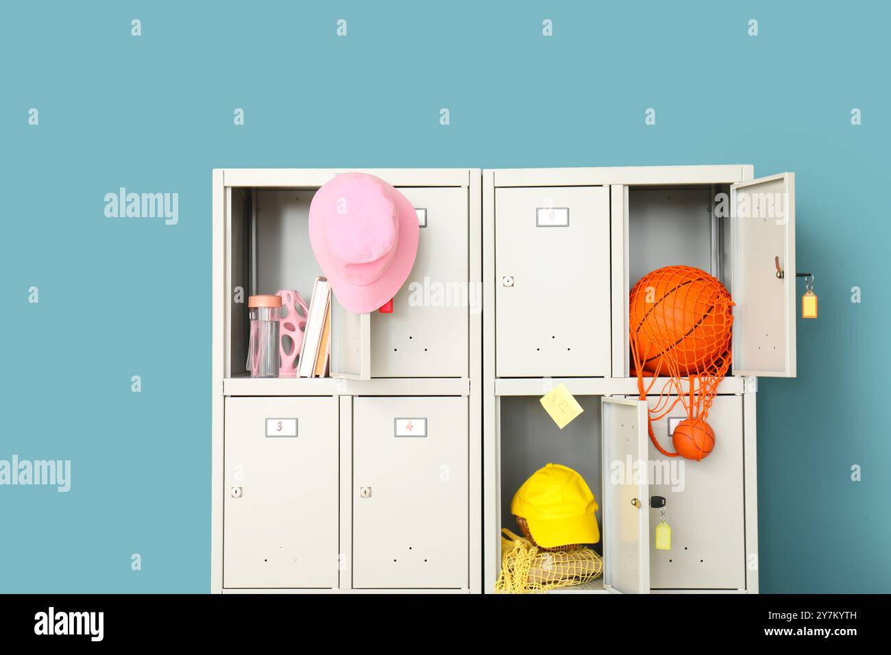 Modern locker with things near blue wall Stock Photo - Alamy