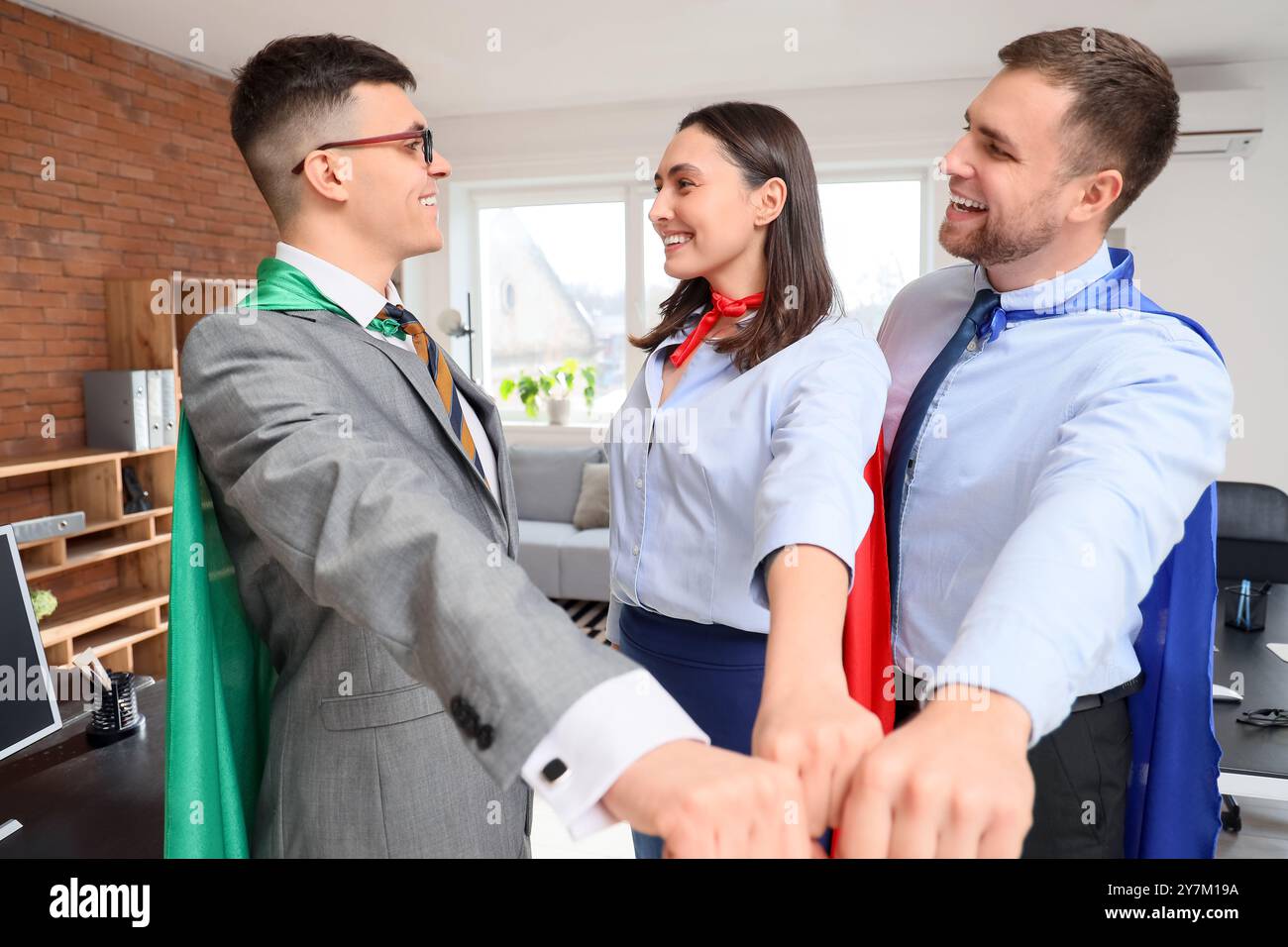 Business people dressed as superheroes in office Stock Photo - Alamy