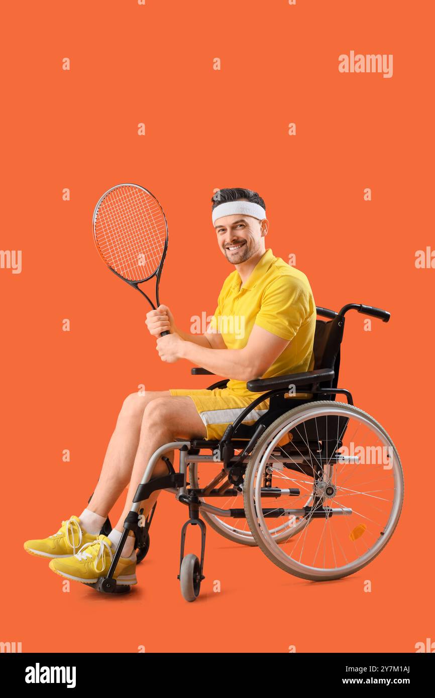 Tennis player in wheelchair with racket on orange background Stock ...