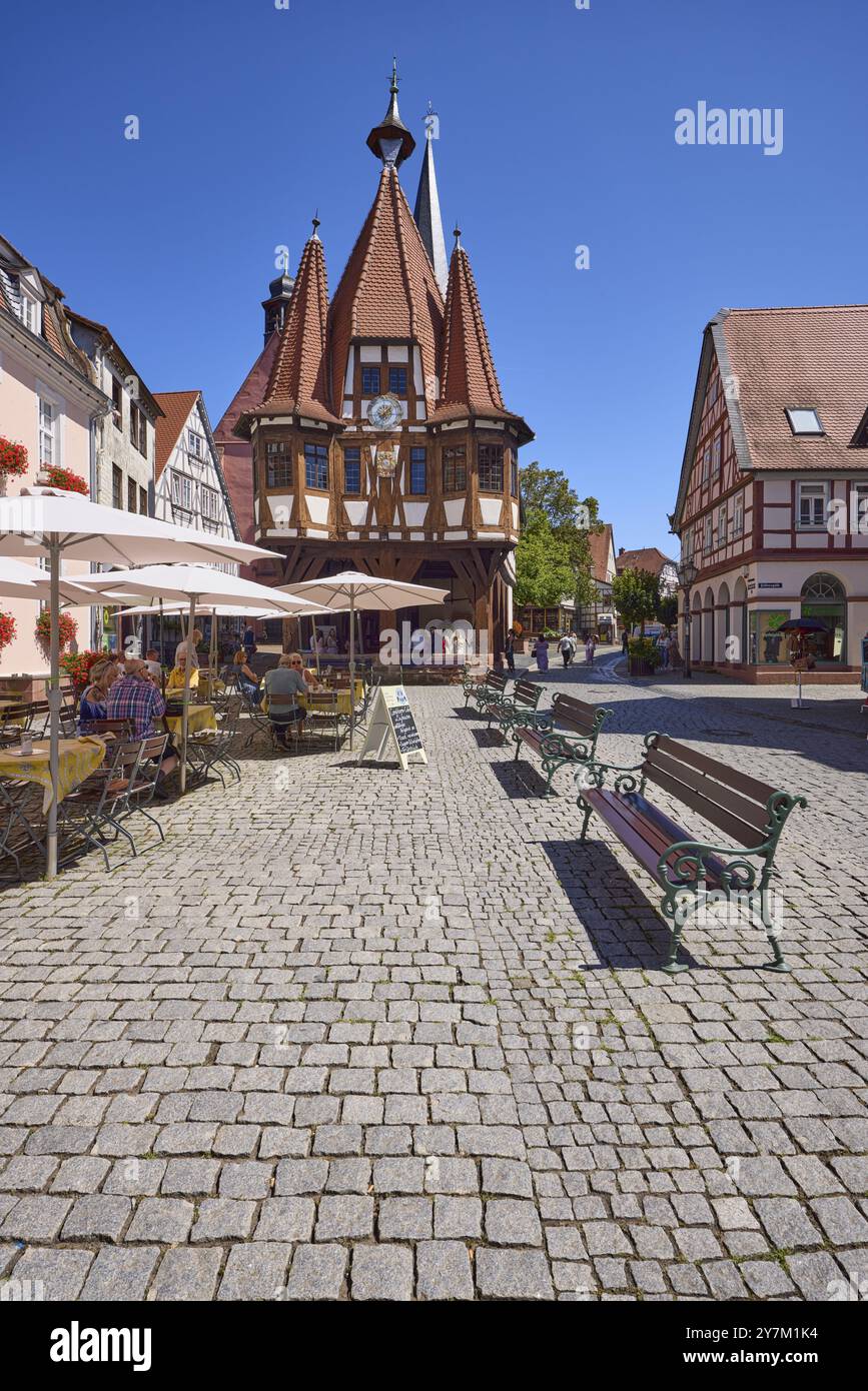 Market square with historic town hall, benches and outdoor area of a ...