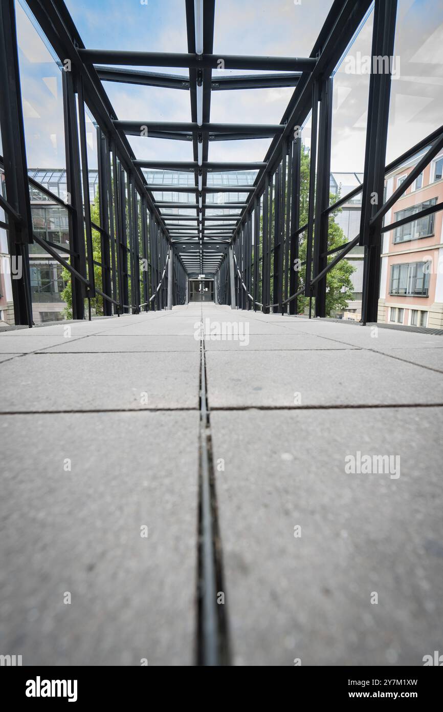 Modern glass and steel overpass connecting two buildings, University of ...