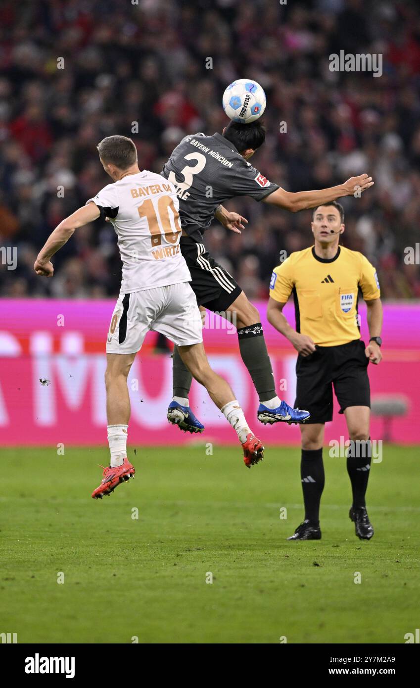 Florian Wirtz Bayer 04 Leverkusen (10) v Min-jae Kim FC Bayern Munich ...