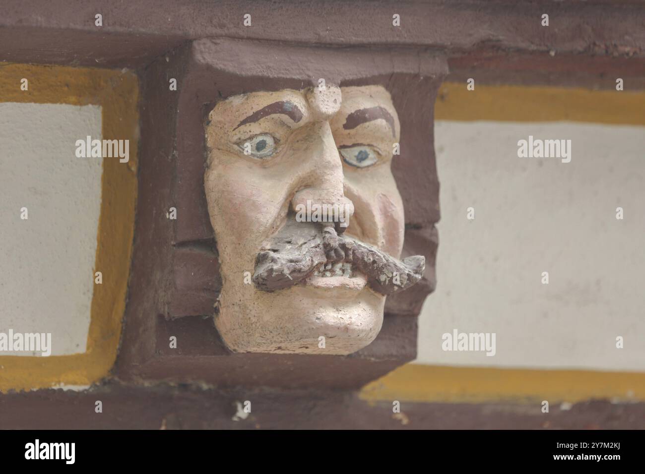 Wood carving with envious head symbolising unchastity, fornication ...