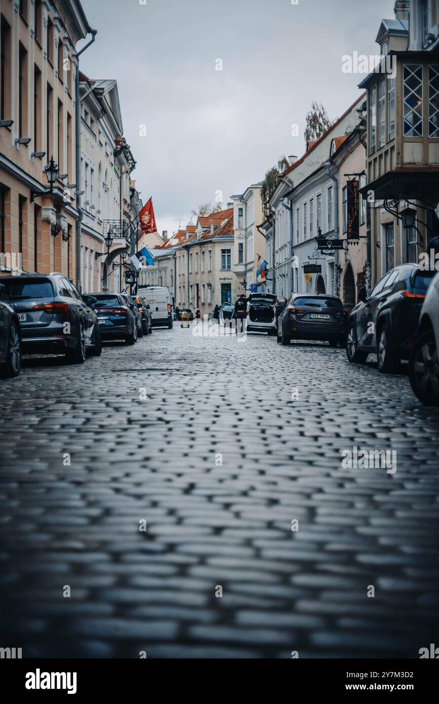 Cobbled street in the old town in Tallinn, Estonia, damp with rain ...