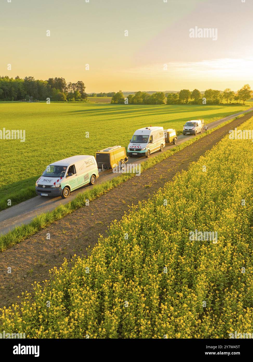 Cars driving past fields in hi-res stock photography and images - Alamy