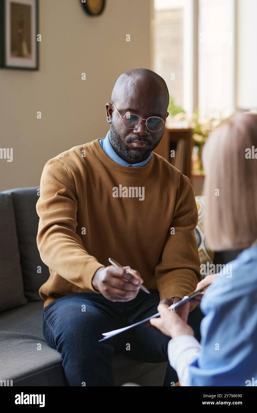Black Man Signing Agreement Stock Photo - Alamy