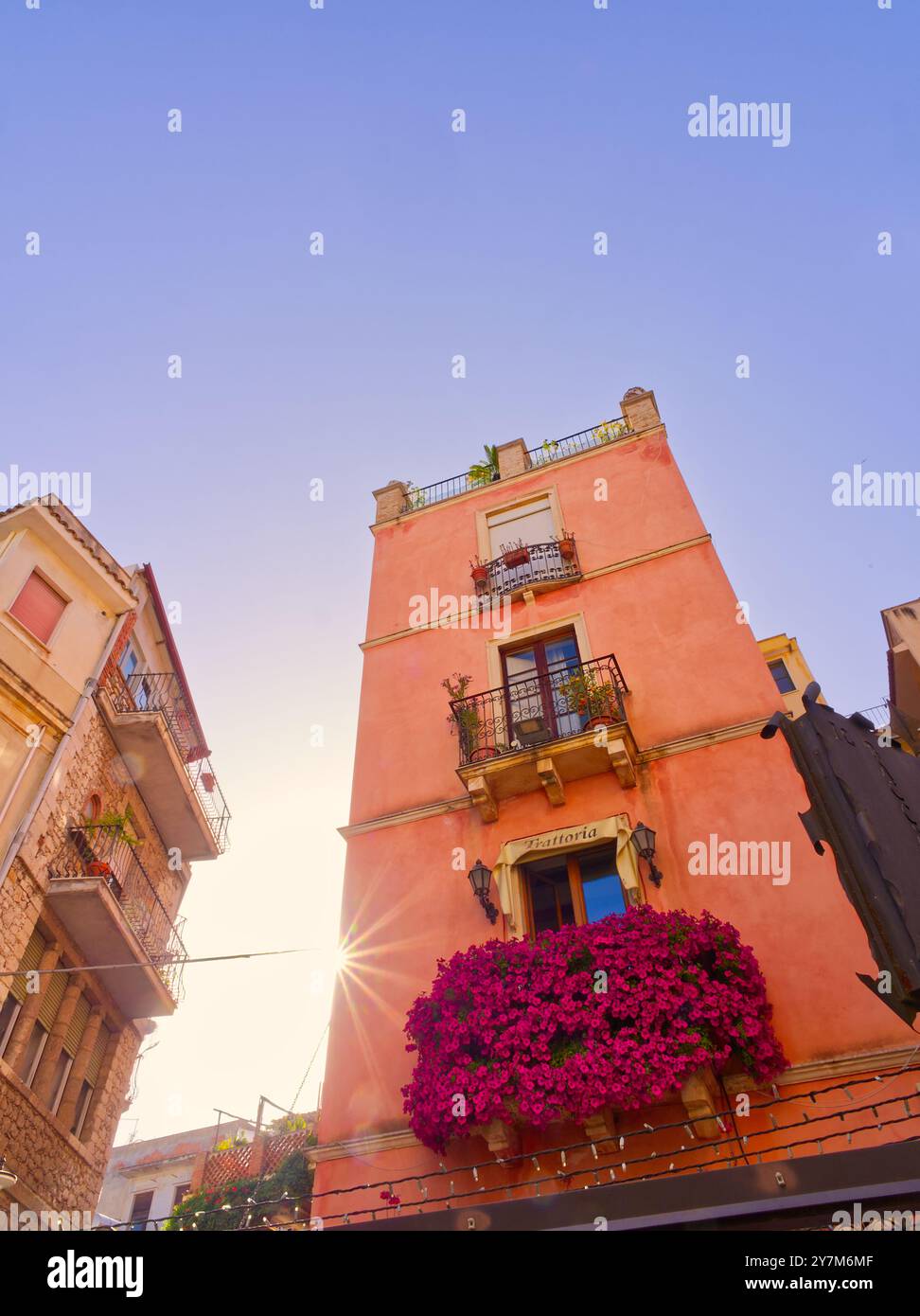 Taormina street building orange facade sun star, Sicily, Italy Stock ...