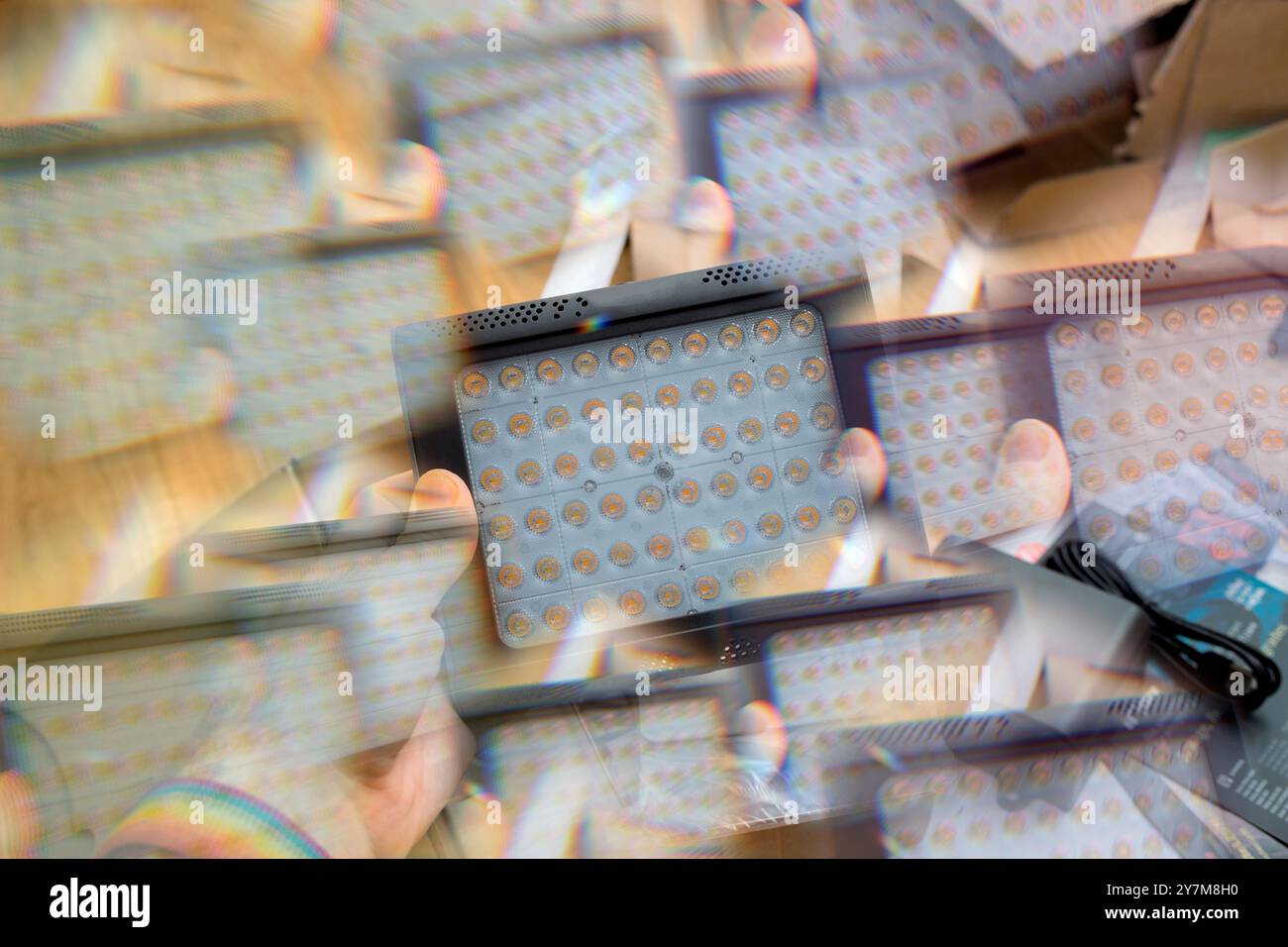 A distorted abstract image of an LED light panel with multiple ...