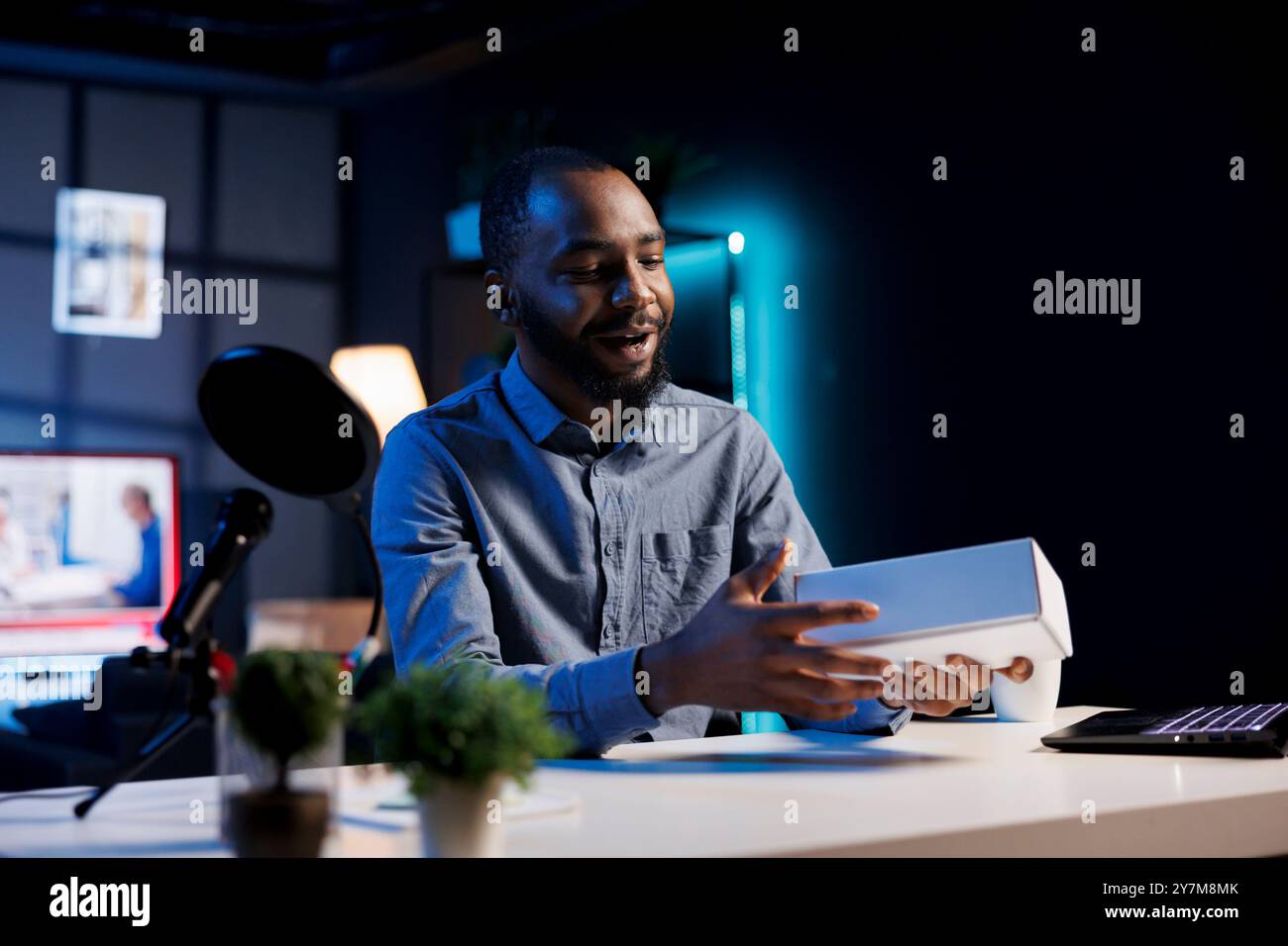 BIPOC tech content creator filming technology review of newly launched ...