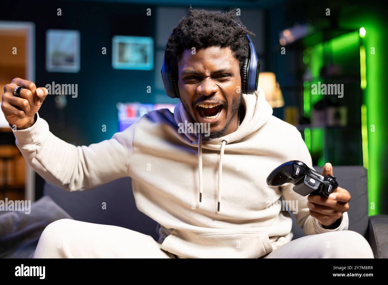 Happy gamer feeling excited after finally defeating all foes and ...