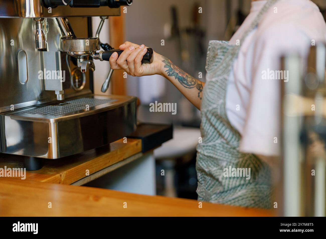 Barista Preparing Coffee in a Chic Caf Setting Stock Photo - Alamy