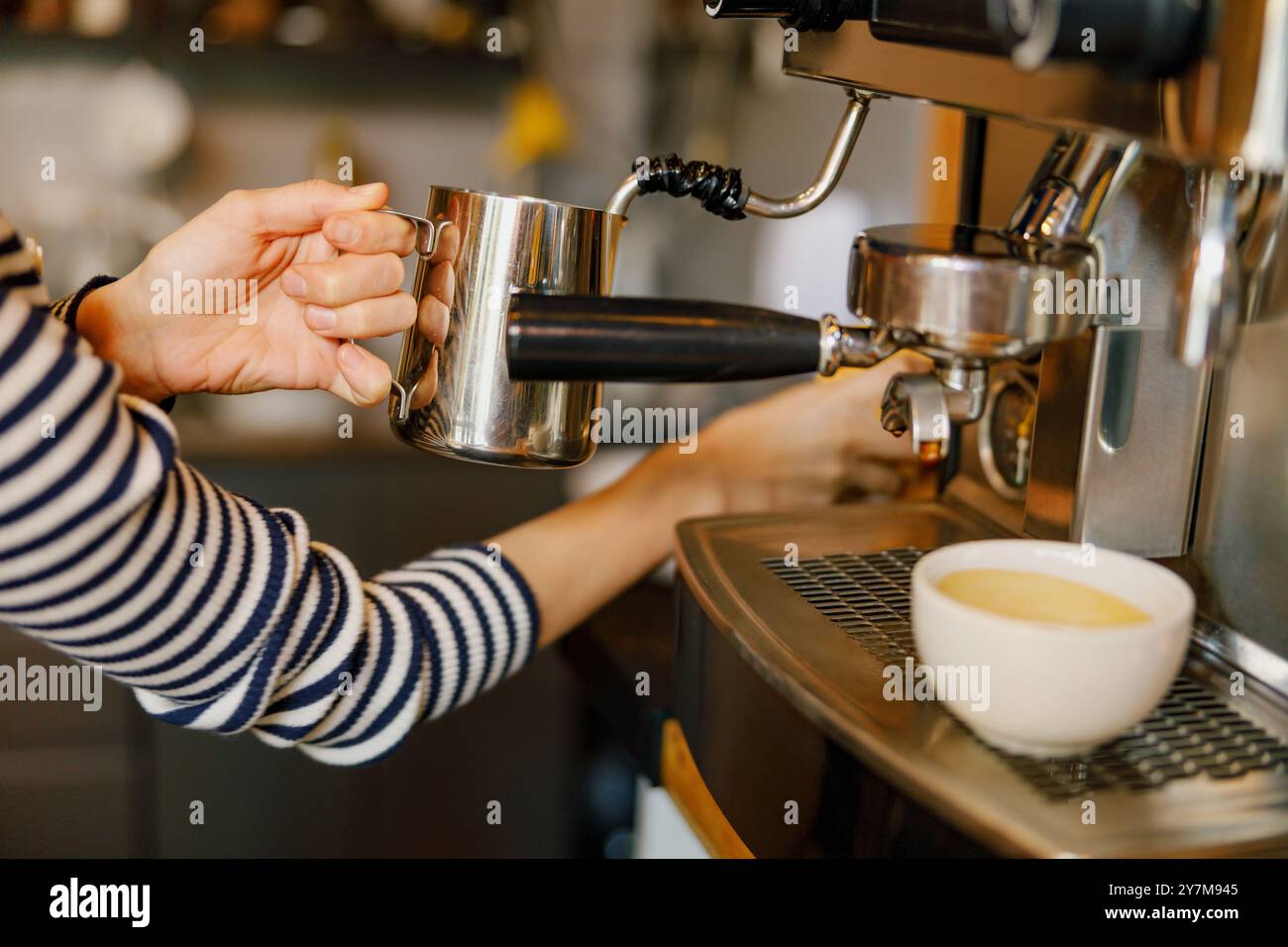 The talented barista skillfully prepares espresso using an impeccable ...