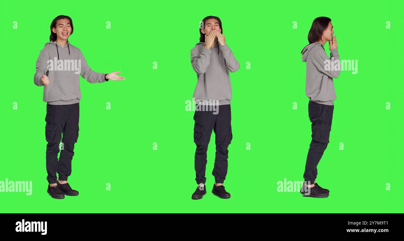 Asian guy sending air kisses on camera, acting flirty and cute standing ...