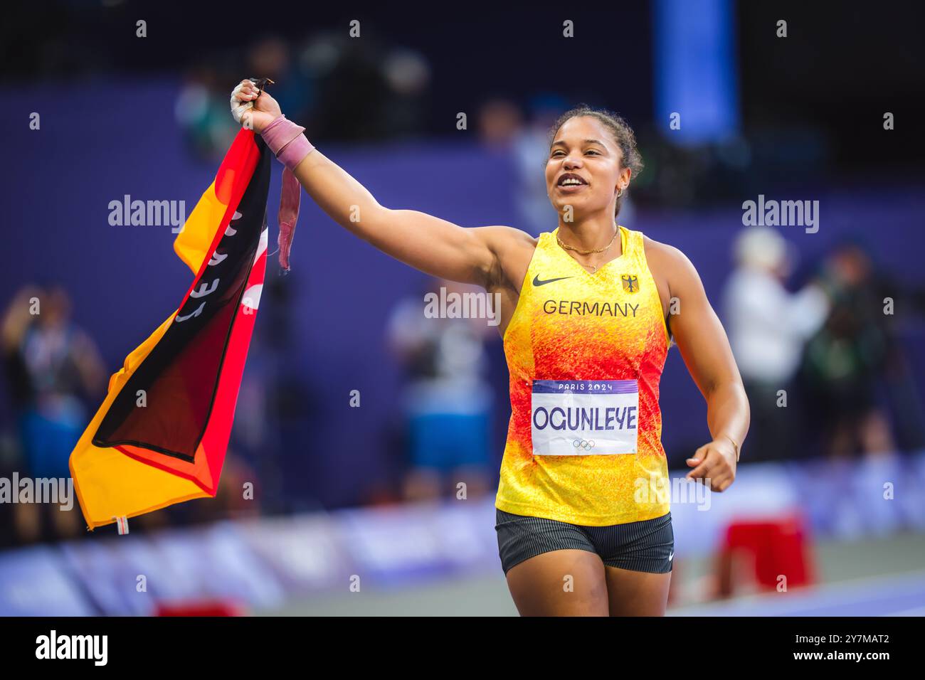 Yemisi Ogunleye celebrating with their country's flag at the Paris 2024 ...