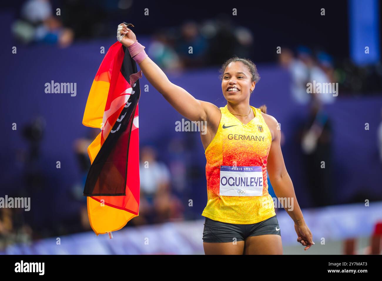 Yemisi Ogunleye celebrating with their country's flag at the Paris 2024 ...