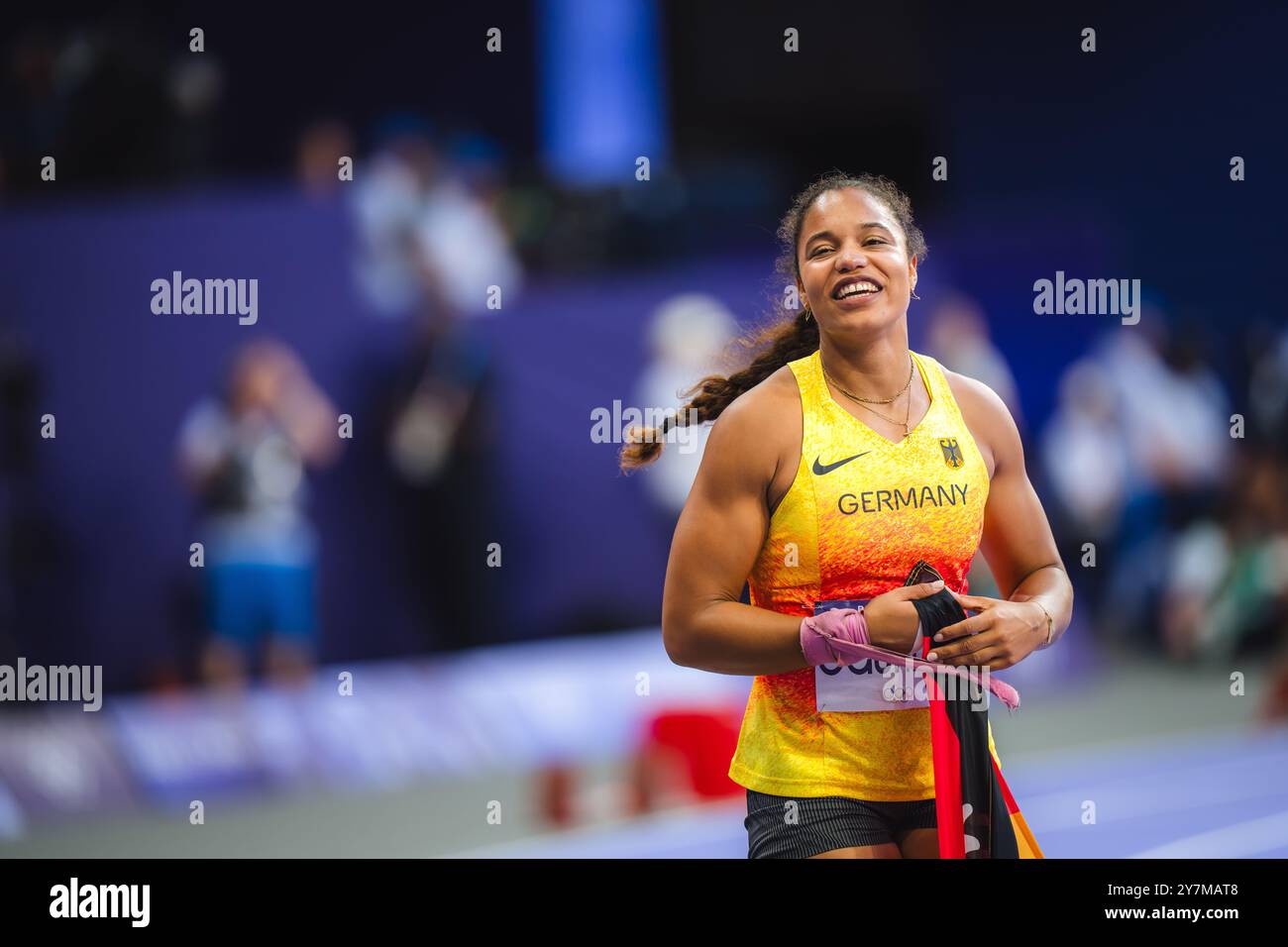 Yemisi Ogunleye celebrating with their country's flag at the Paris 2024 ...