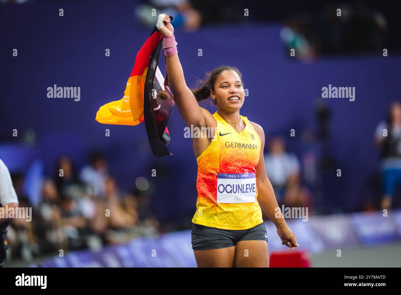 Yemisi Ogunleye celebrating with their country's flag at the Paris 2024 ...