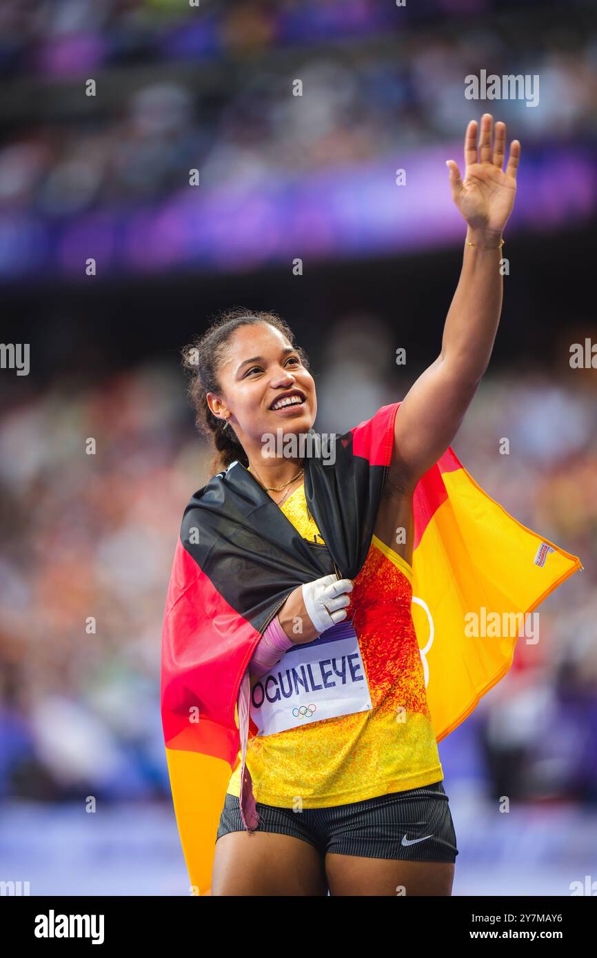 Yemisi Ogunleye celebrating with their country's flag at the Paris 2024 ...