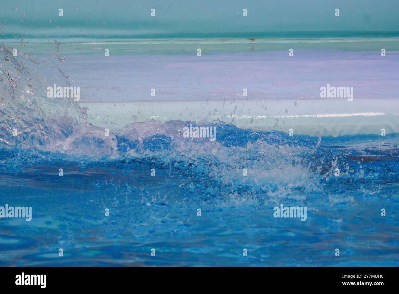 Captivating Water Splash in a Crystal Clear Pool Under Bright Sunlight ...