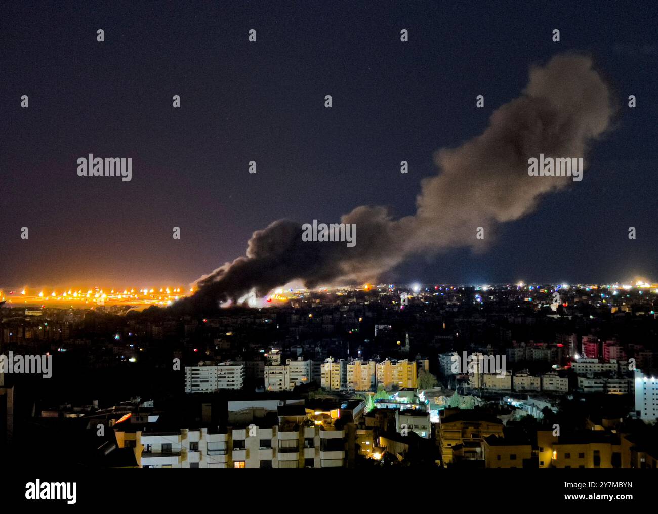 Smoke rises from an Israeli airstrike that hit the southern suburb of ...