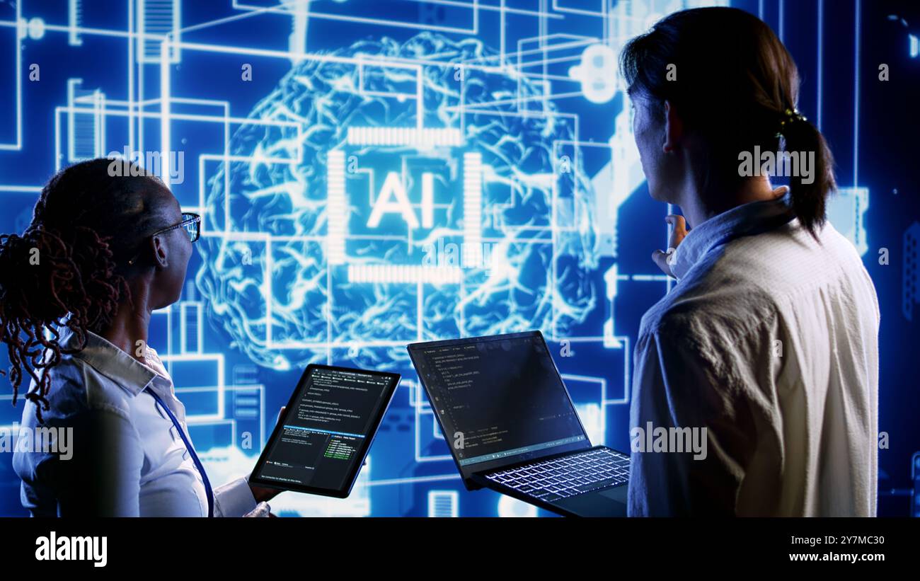 Teamworking colleagues updating ai hi-res stock photography and images - Alamy