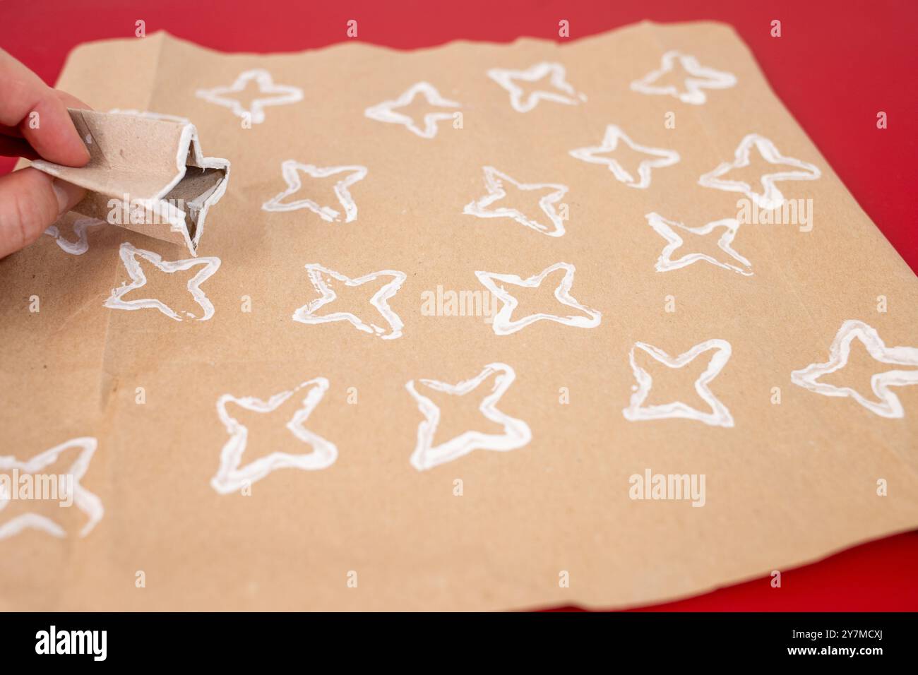 Crafting stars by folding paper rolls into shapes, DIY project for kids ...