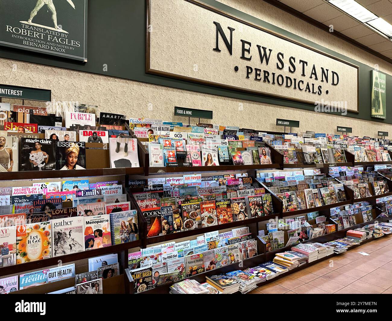 A view of current event magazines on display shelves at the Barnes and ...