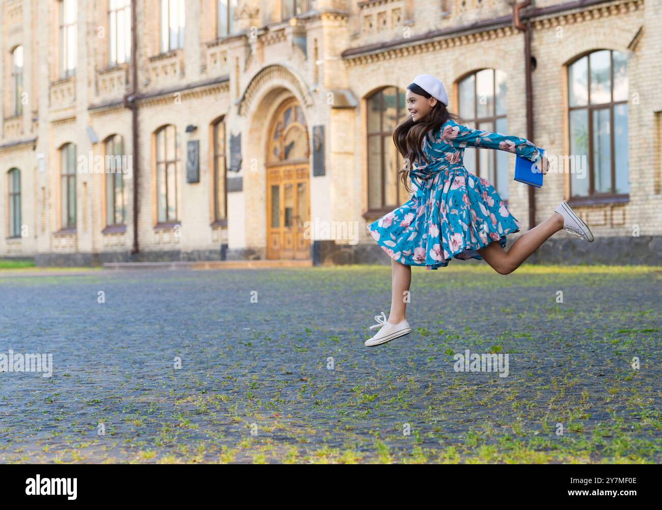 Teen girl jumping back to school. Knowledge day. Education in school ...